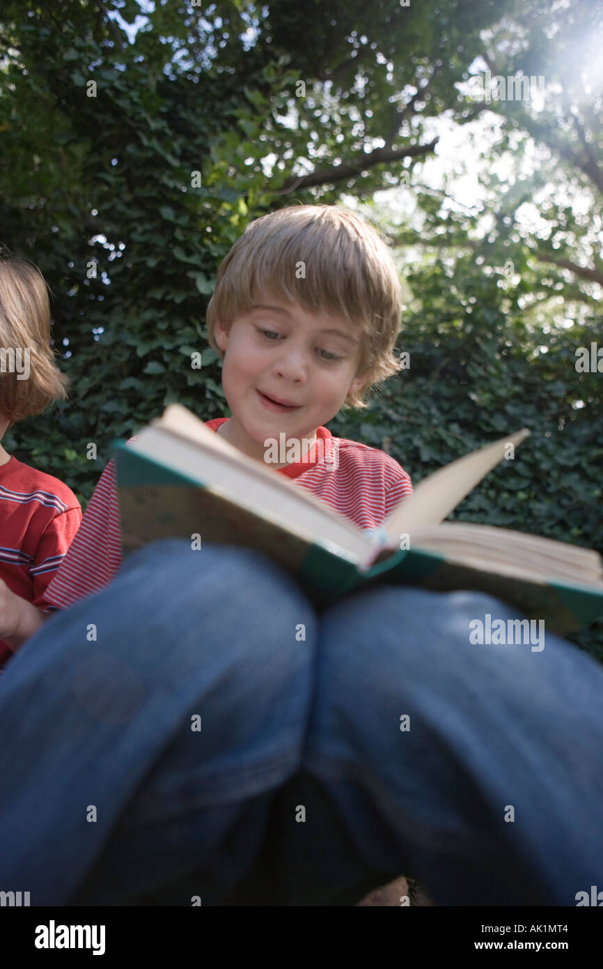 boy reading outdoors Stock Photo - Alamy