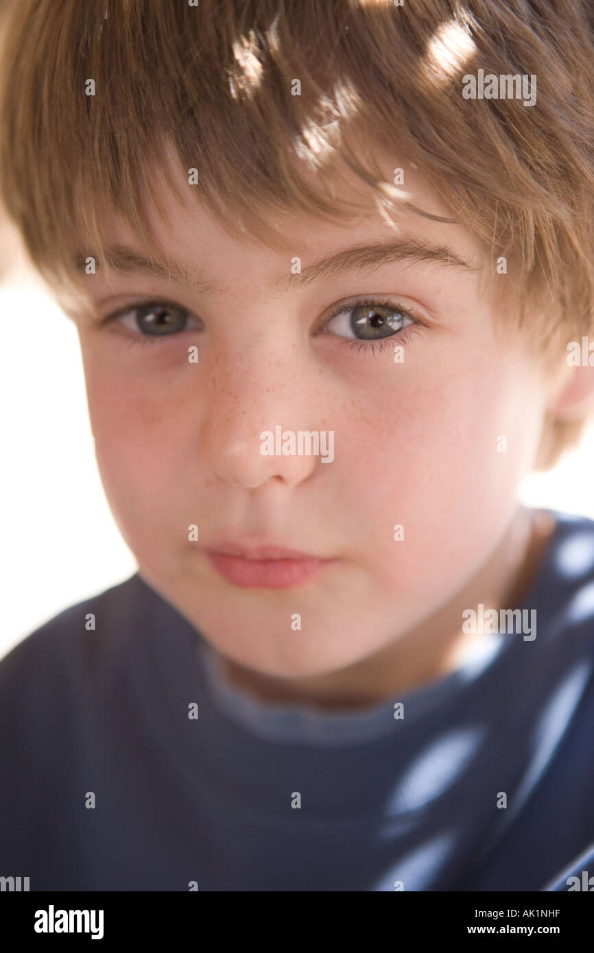 portrait of seven year old with serious, focused expression Stock Photo ...