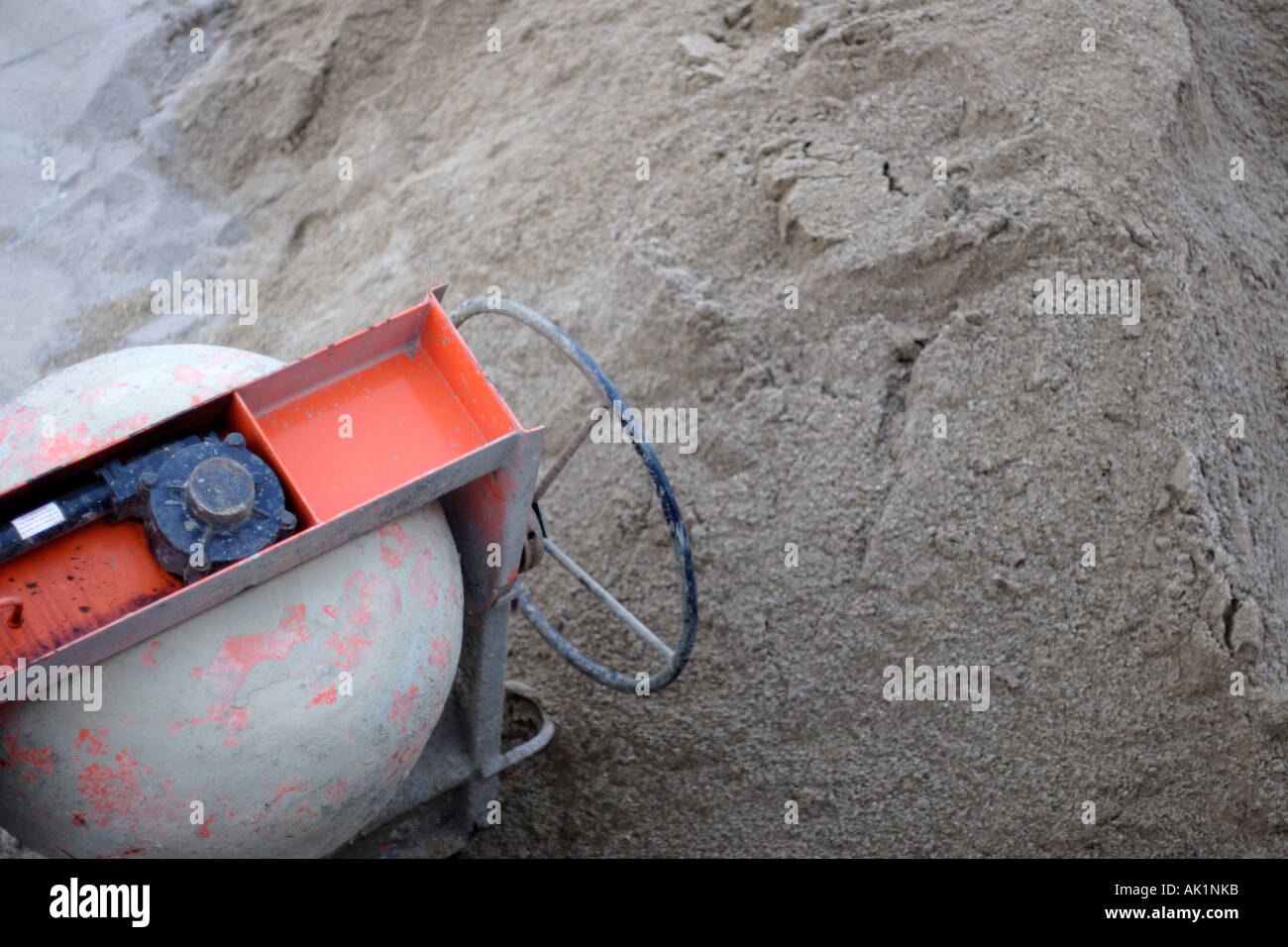 Overhead view of cement mixer and pile of building sand Stock Photo - Alamy