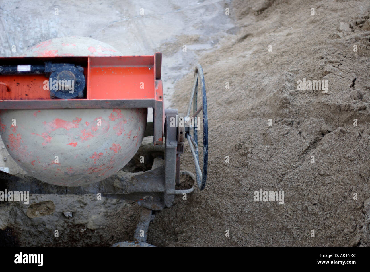 Overhead view of cement mixer and pile of sand Stock Photo - Alamy