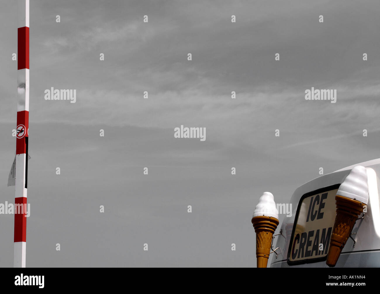 Detail of ice cream van and two cones with lifted red and white traffic ...