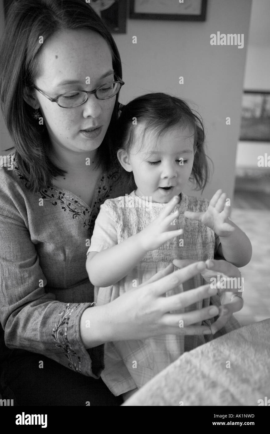 mother and child using sign language in song Stock Photo - Alamy