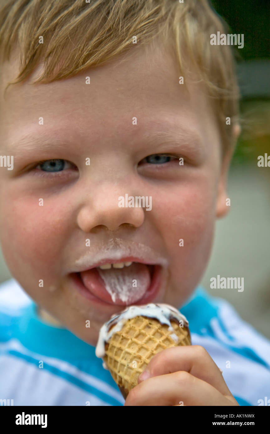 Boy eating ice cream cone child close up cone consuming hi-res stock ...