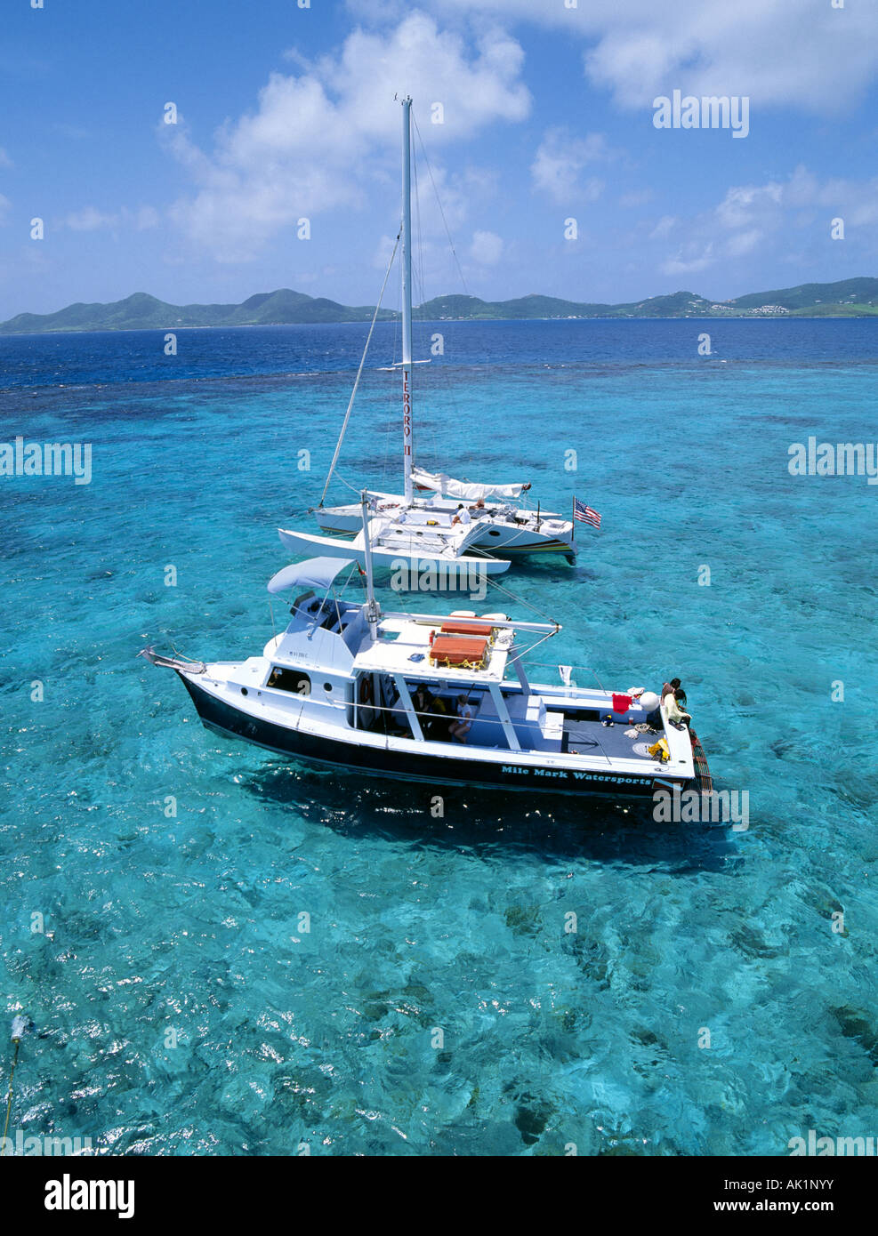 Scuba and snorkeling dive boats anchor over the coral reef at Buck ...