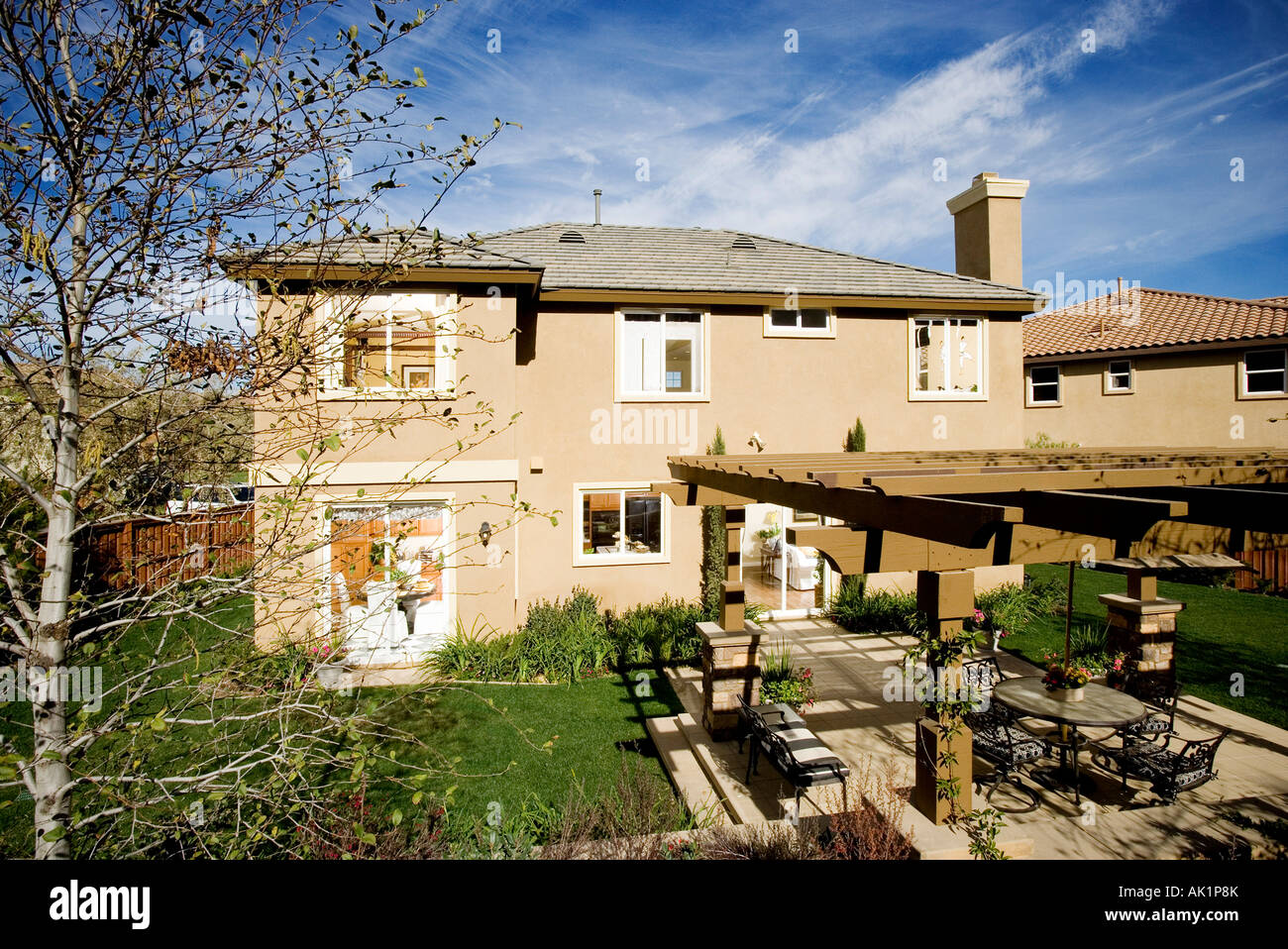 Rear Exterior of Home with Large Terrace Patio Stock Photo - Alamy