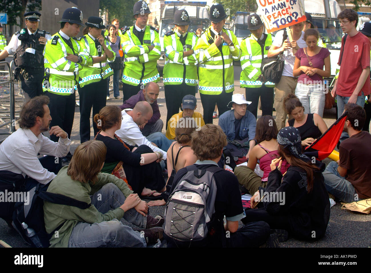 A group of peace activists stage a sit-down protest outside Downing ...