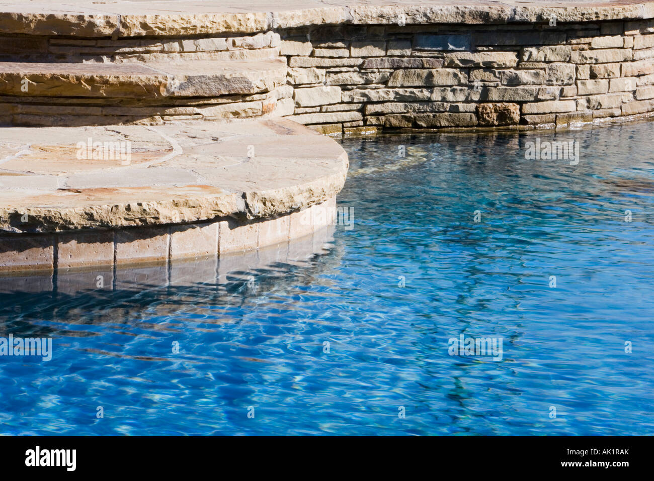 Swimming Pool and Stone Pool Deck Stock Photo - Alamy
