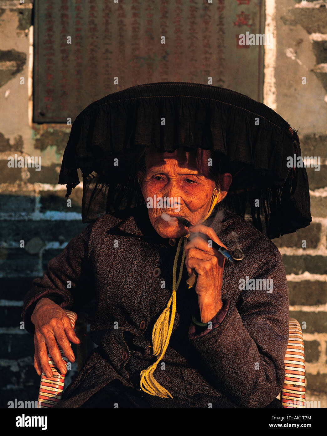Old woman smoking pipe hi-res stock photography and images - Alamy