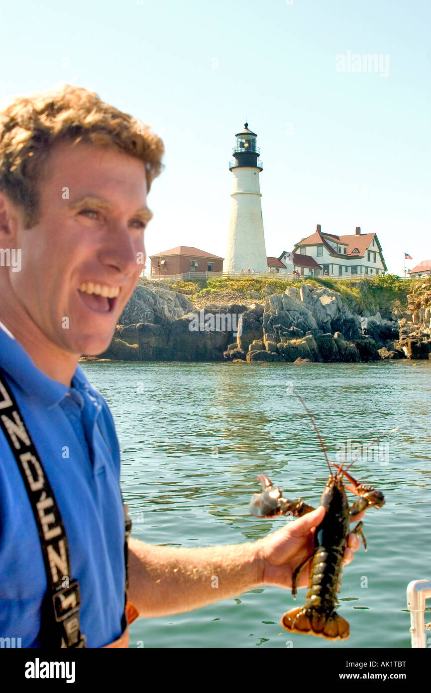 The Captain of the lobsterman Lucky Catch shows a lobster off Portland ...