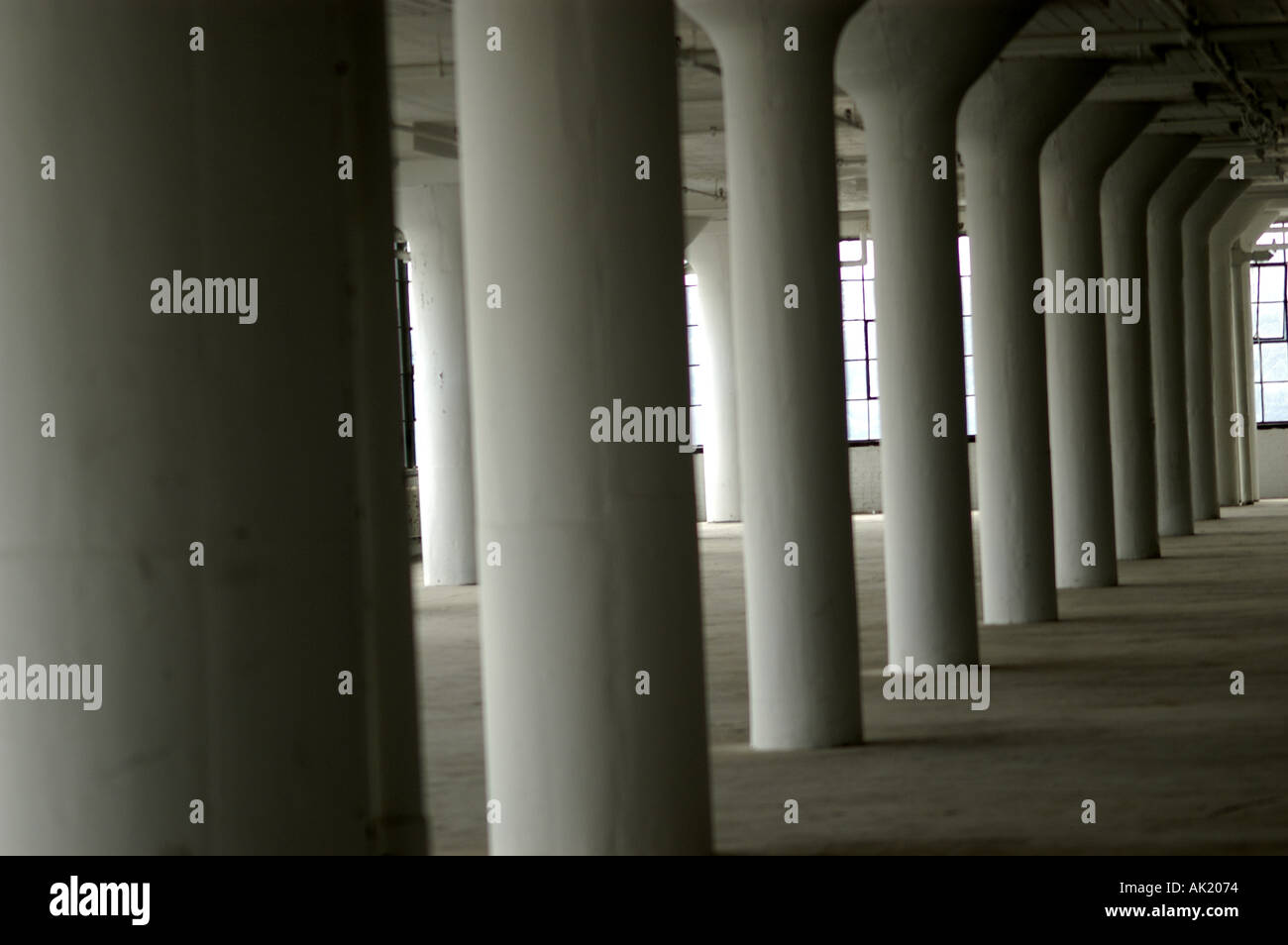 Empty space loft NY New York City pillars window glow horizontal Stock ...