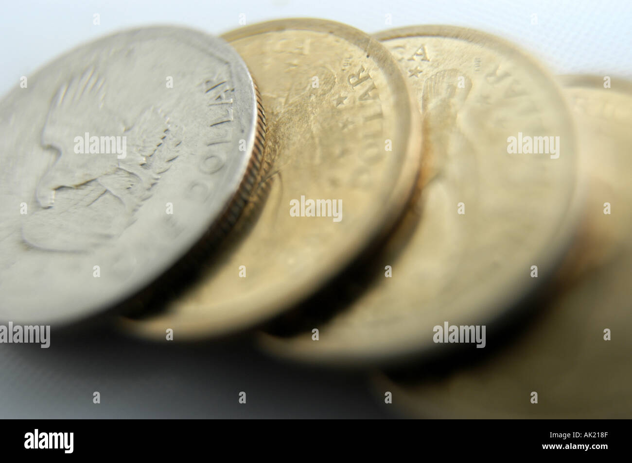 Coins overlapping horizontal Stock Photo - Alamy