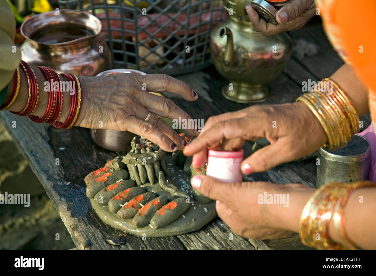 Women preparing a puja ceremony. Tulsi ghat. Ganges river. Varanasi ...