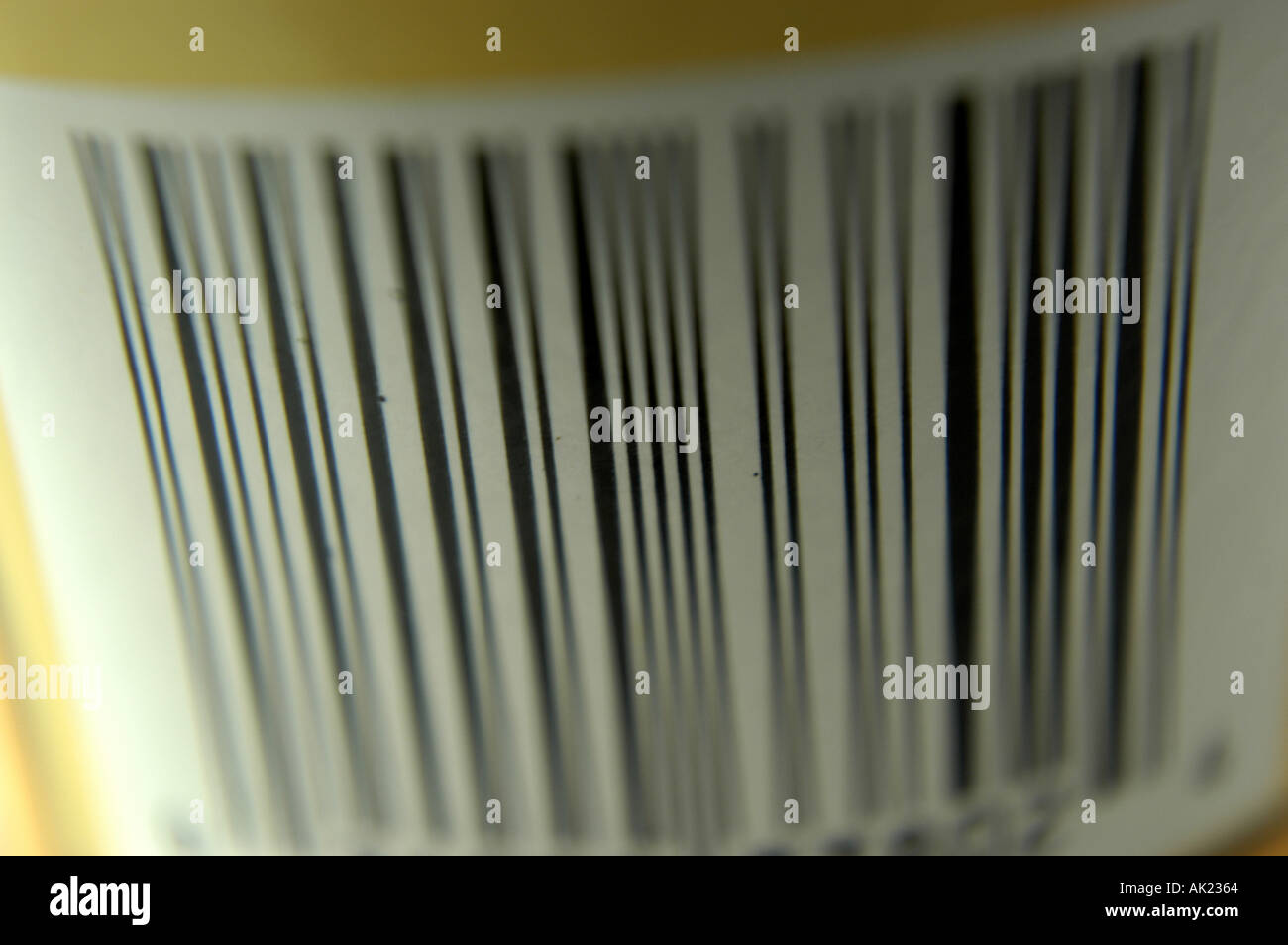 Rounded barcode upright below blurred text on round object Stock Photo ...