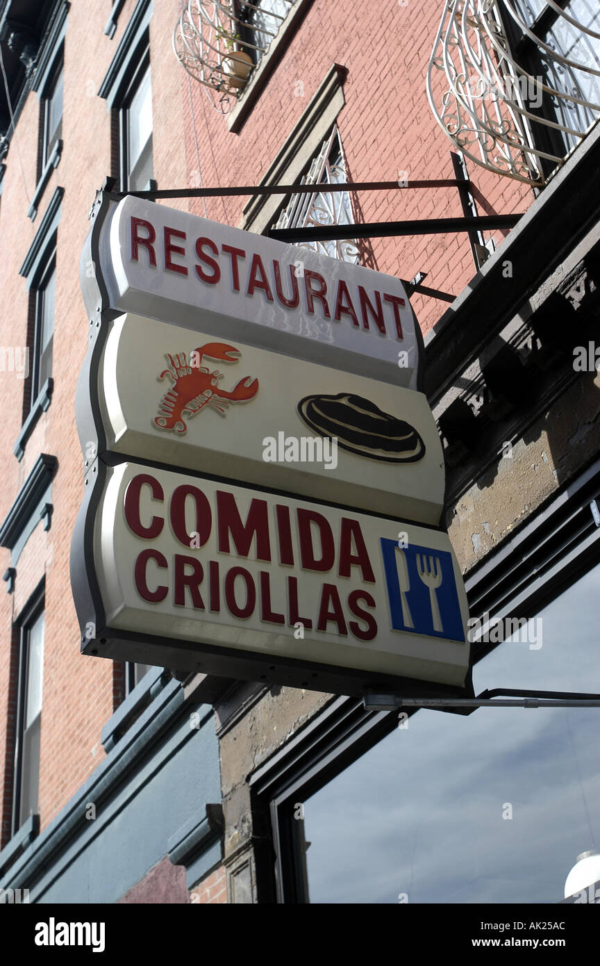 Spanish NY Signs street sign Comida Food vertical Stock Photo - Alamy