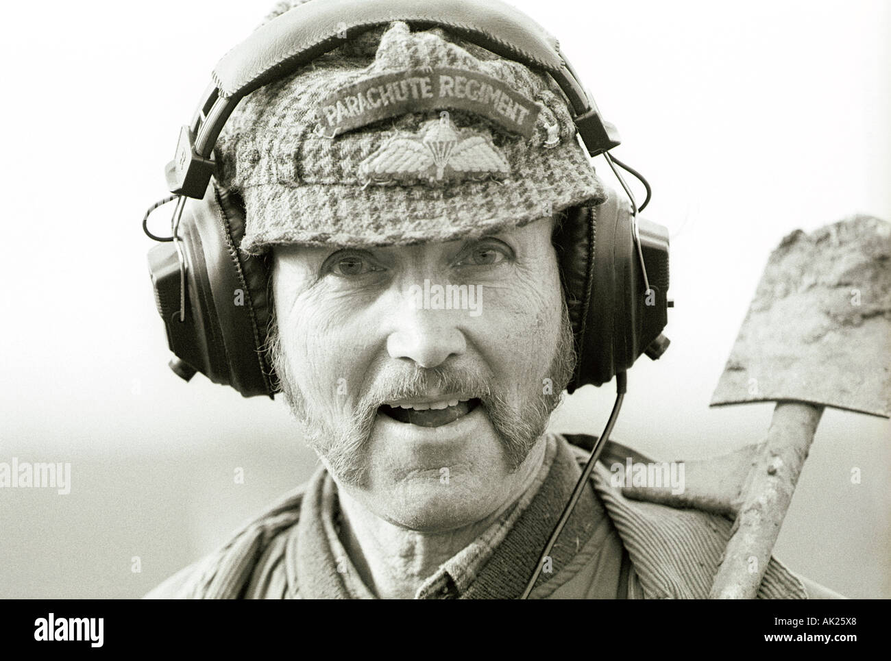 A detectorist listening for the signal from his metal detector Stock ...