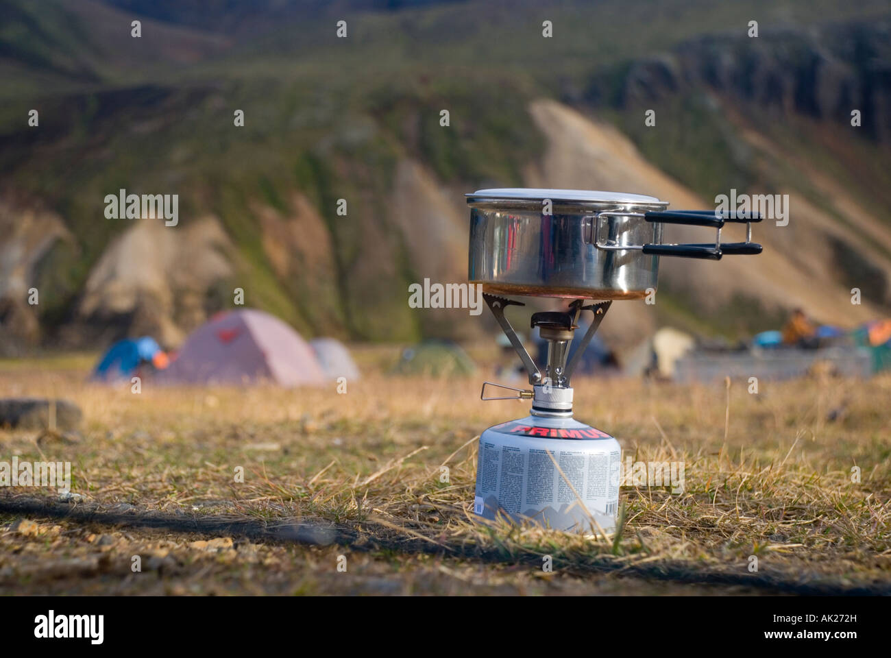 Boiling some water on a camping stove at a site in Iceland Stock Photo ...