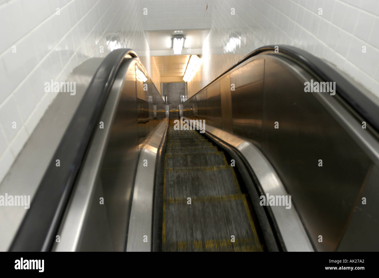 Steps silver steps escalator NY subway horizontal Stock Photo - Alamy