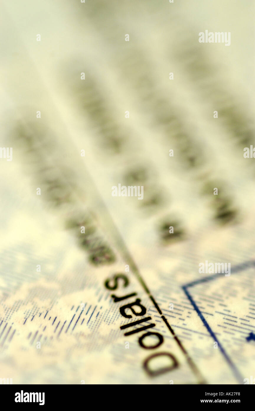 Dollars and Check Cheque Partial vertical Stock Photo - Alamy