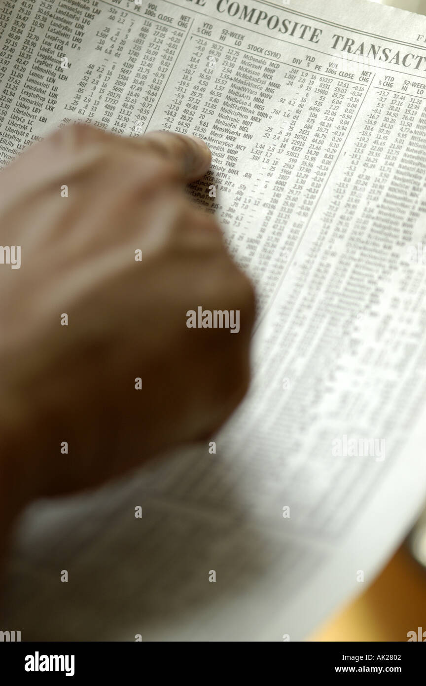 Hand on list of figures vertical Stock Photo - Alamy