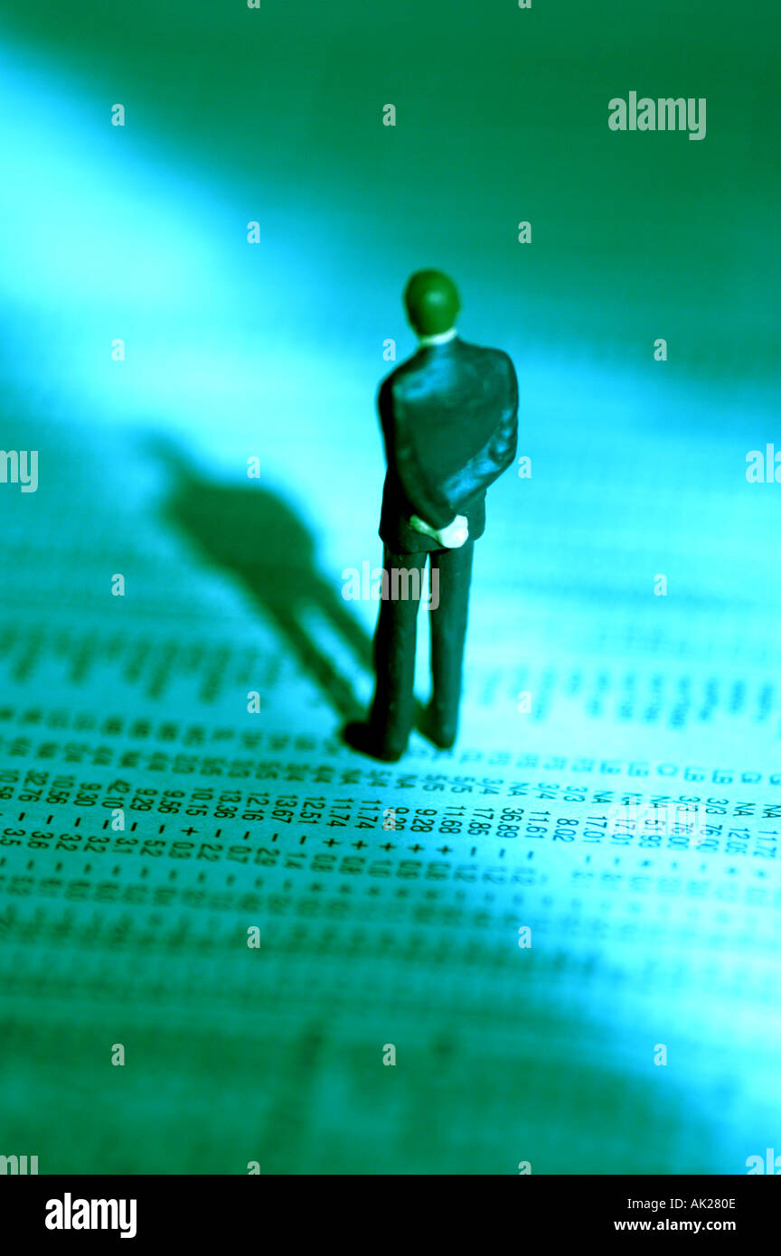 Miniature male figure on page of stock ray of light vertical Stock ...