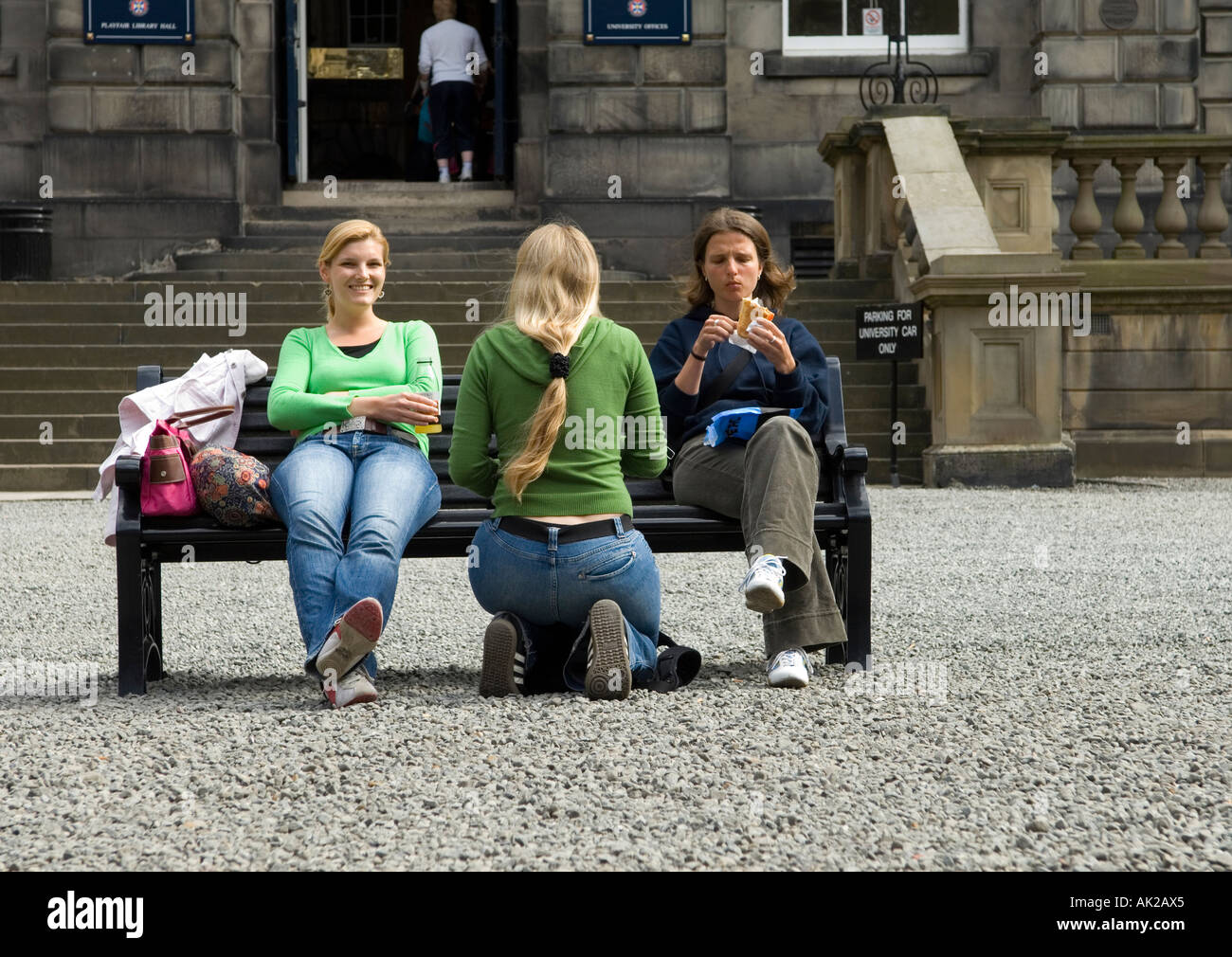 Three female students enjoying a break in University courtyard Stock ...