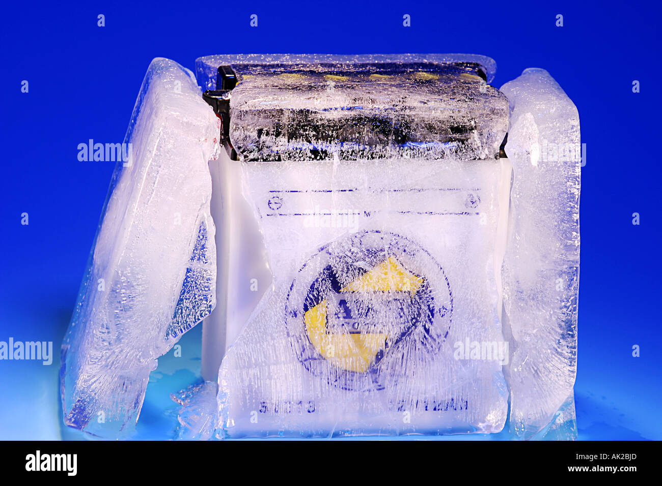 Battery in ice Stock Photo - Alamy
