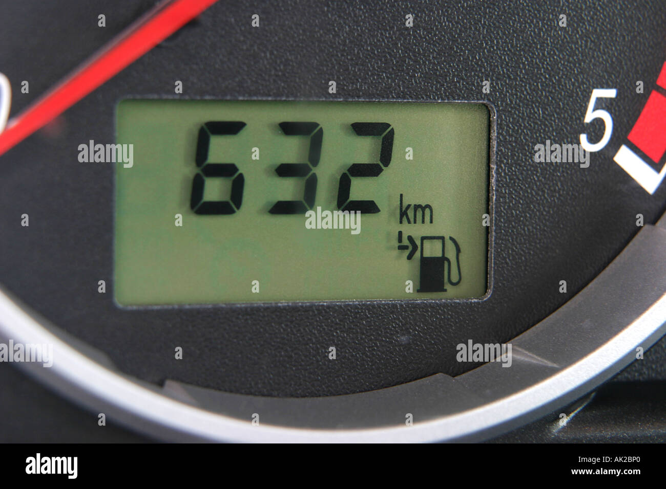 Digital display for remaining kilometers in the car Stock Photo - Alamy