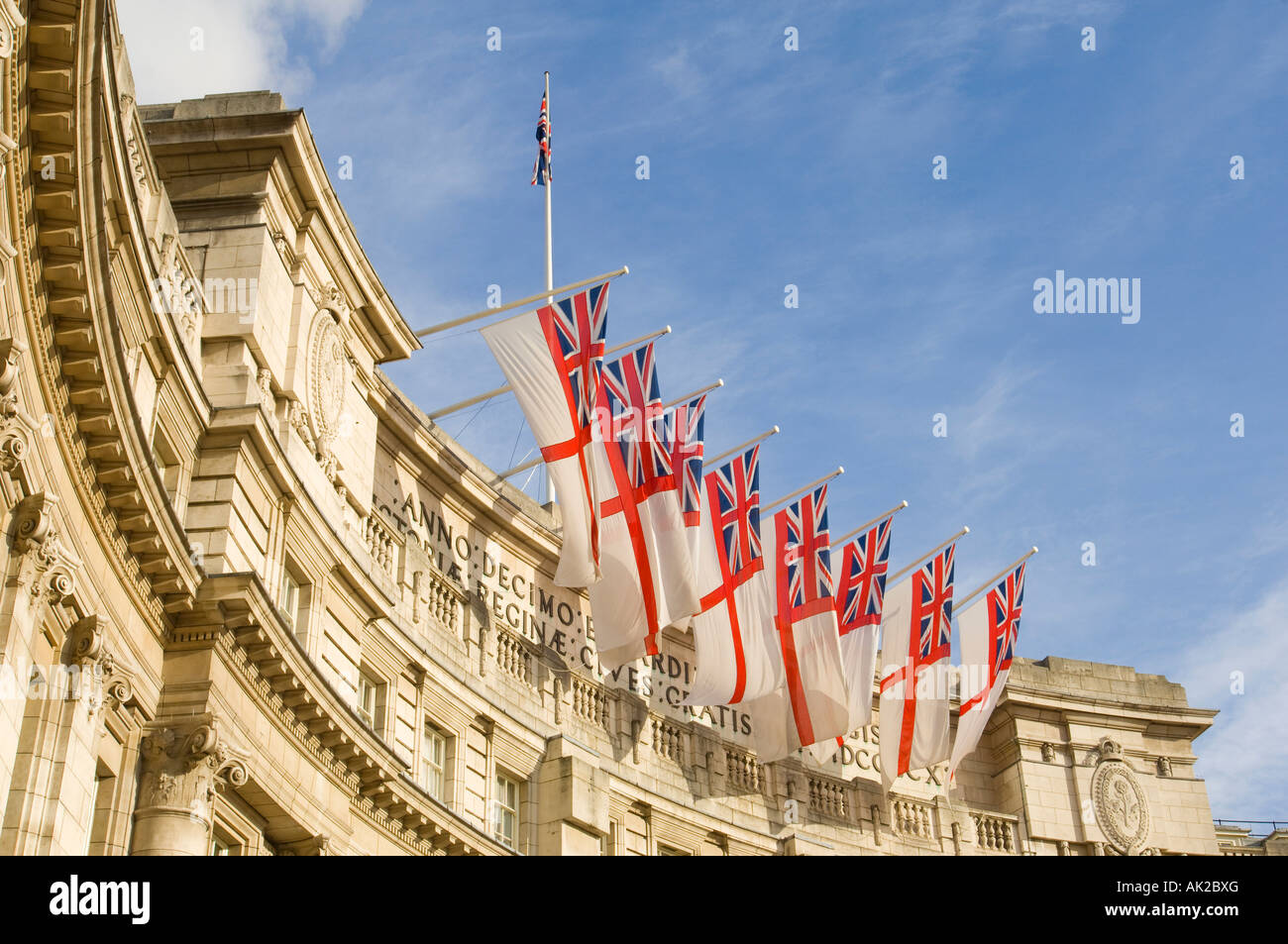 A close up view of the top of Admiralty Arch and white ensign flags ...