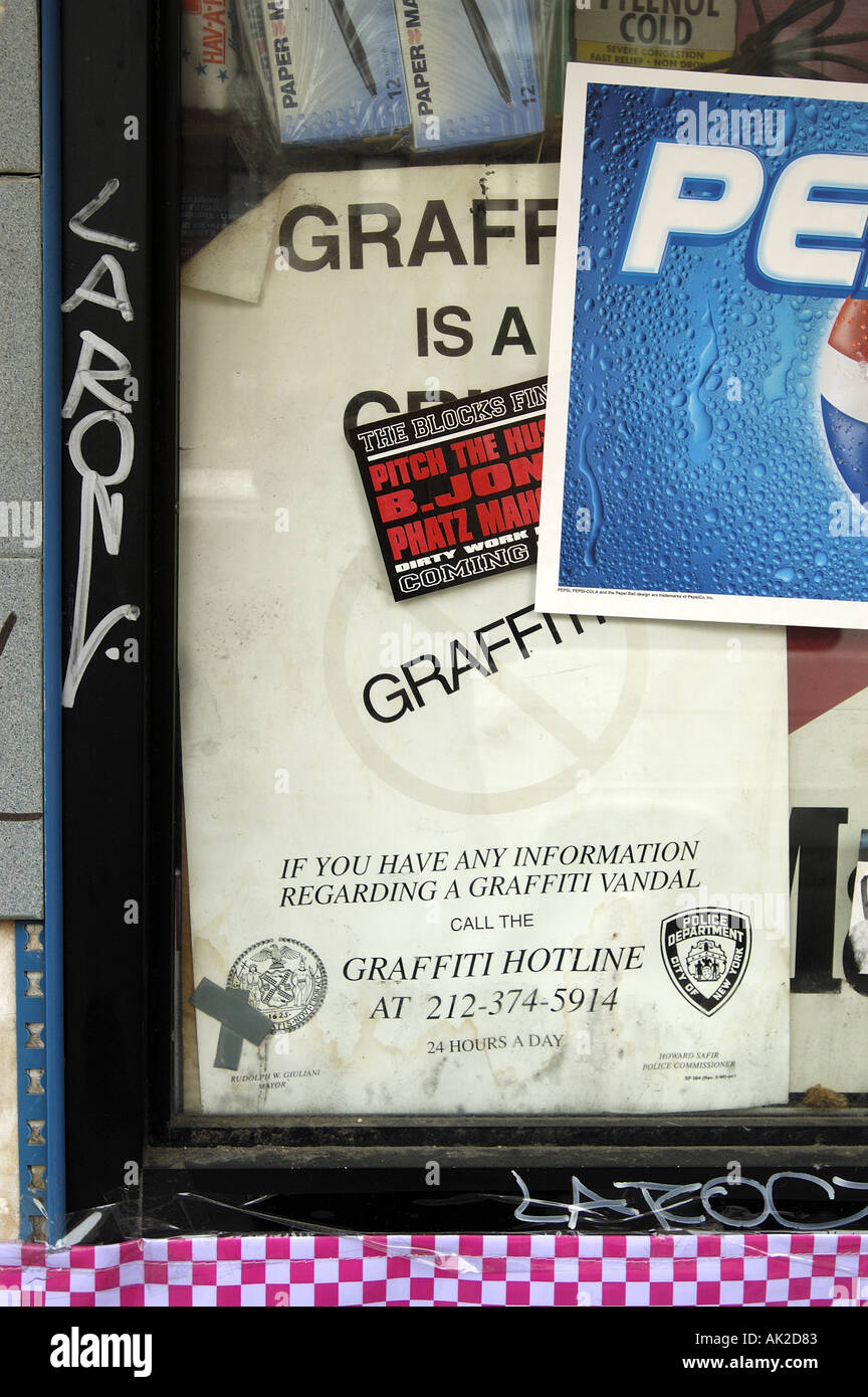 NY Grafitti graffiti street signs Stock Photo - Alamy