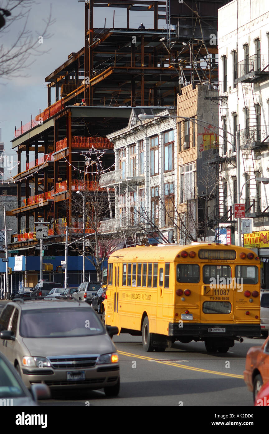 NY Harlem street scene building school bus vertical Stock Photo - Alamy