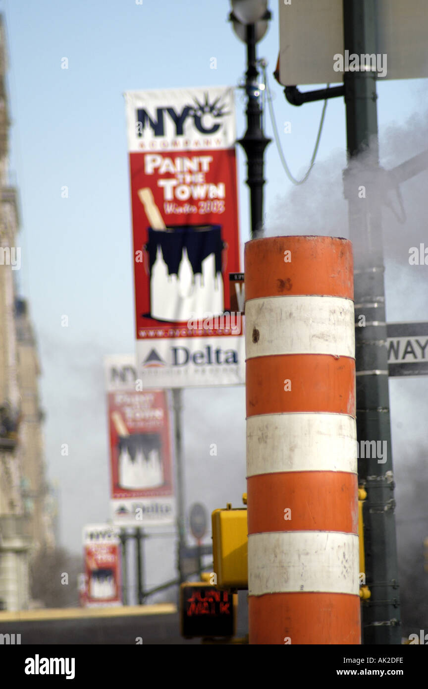 NYC sign underground manhole smoke vertical Stock Photo - Alamy