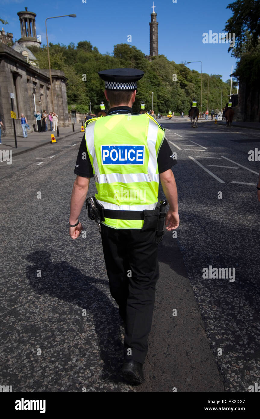 Police Officer walking Stock Photo - Alamy
