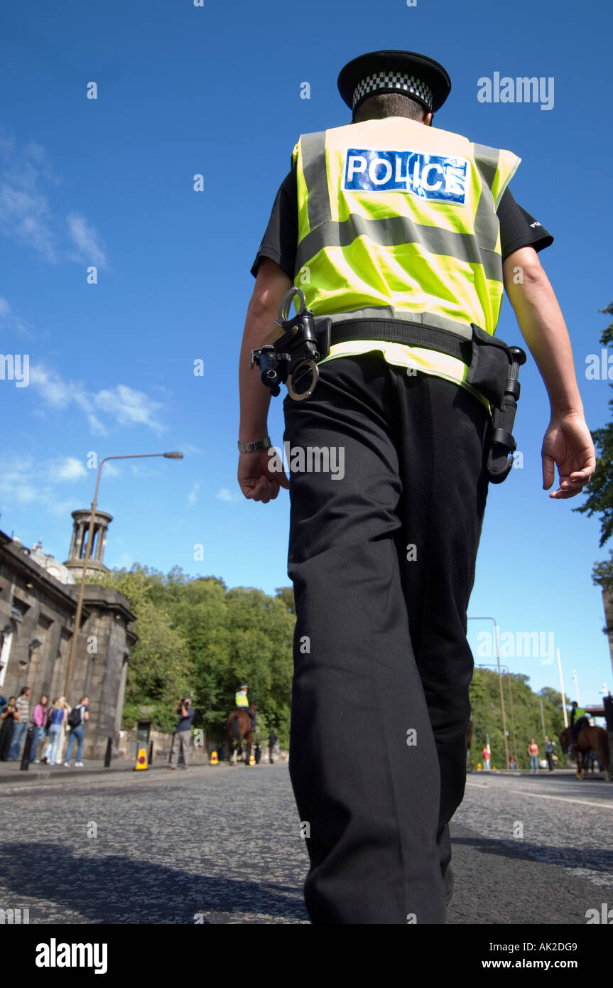 Police Officer walking Stock Photo - Alamy