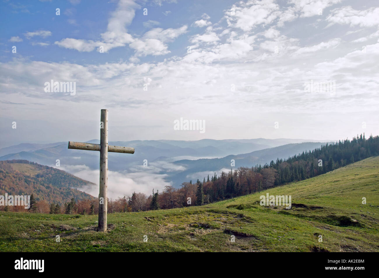 Cross on fall mountain plateau Stock Photo - Alamy