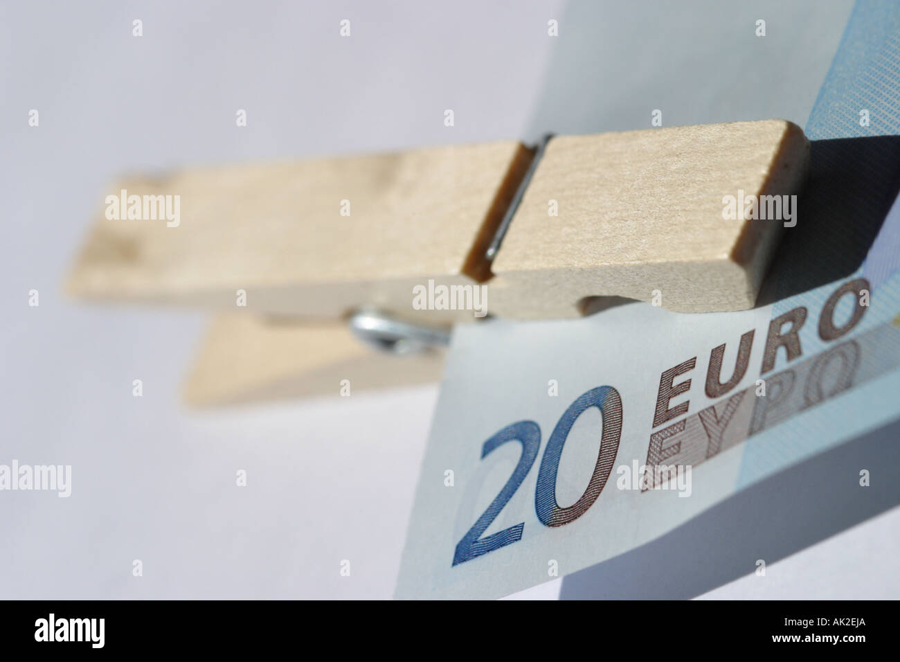 Euro bank note caught in washing clothes peg Stock Photo - Alamy