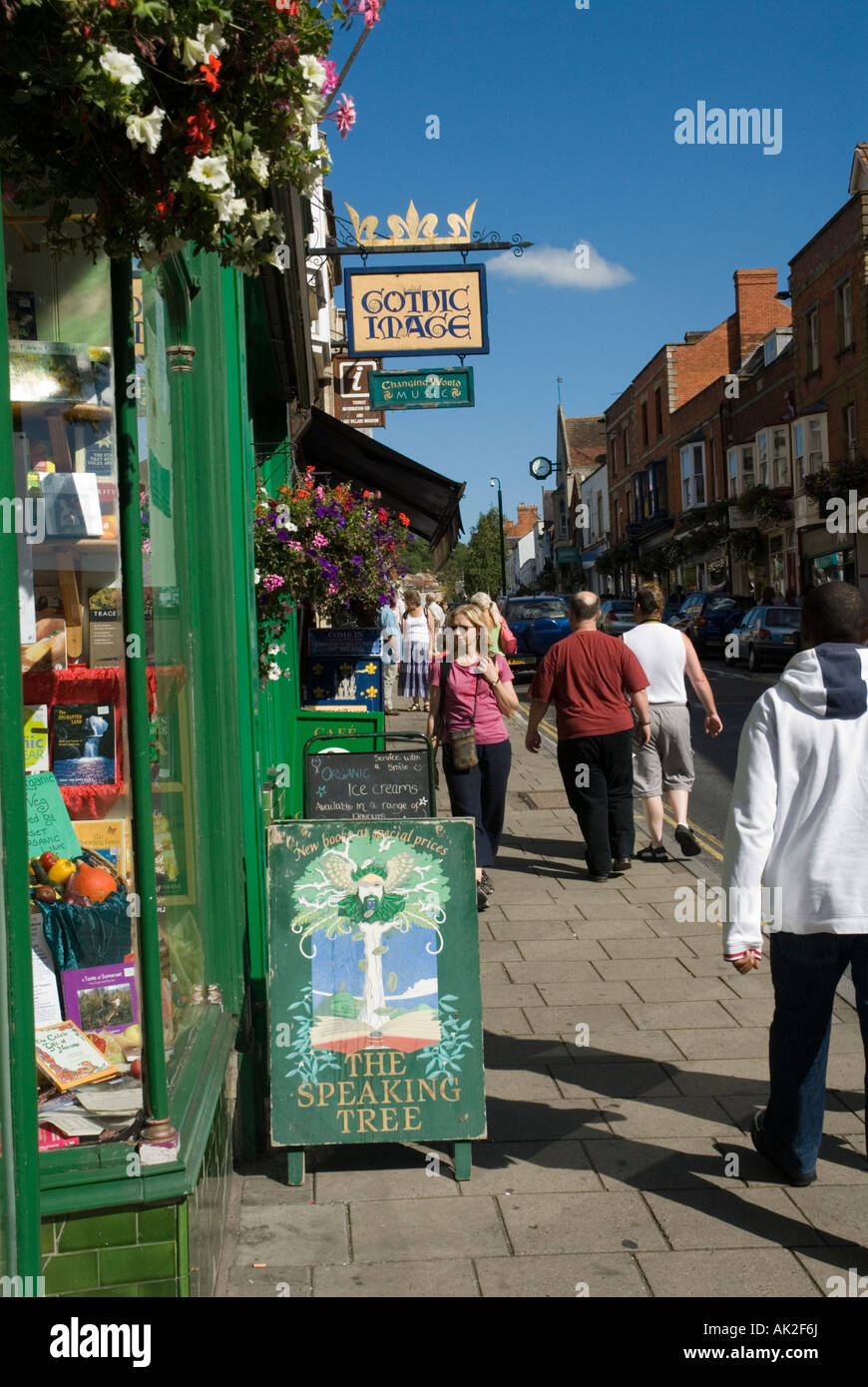 Town centre high street Glastonbury with funky shops Somerset England ...
