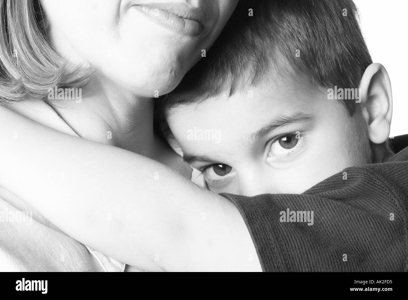 Little boy hugging his mother Stock Photo - Alamy