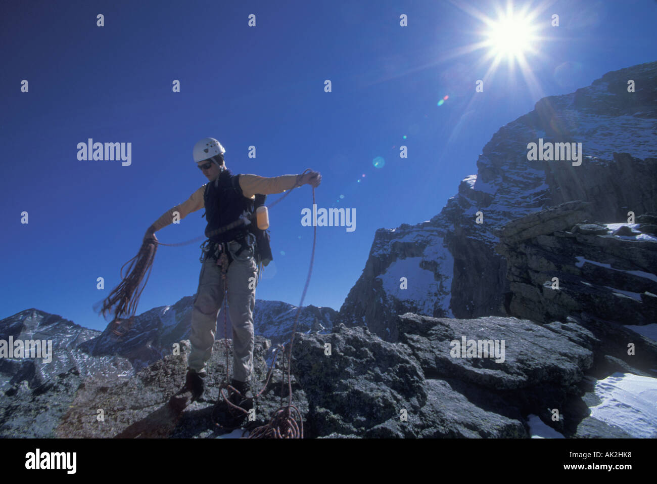 Climber coiling a rope Stock Photo - Alamy