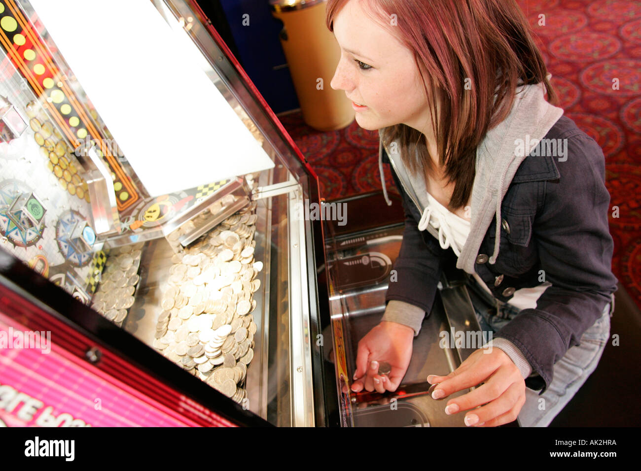 Money in the slot hi-res stock photography and images - Alamy
