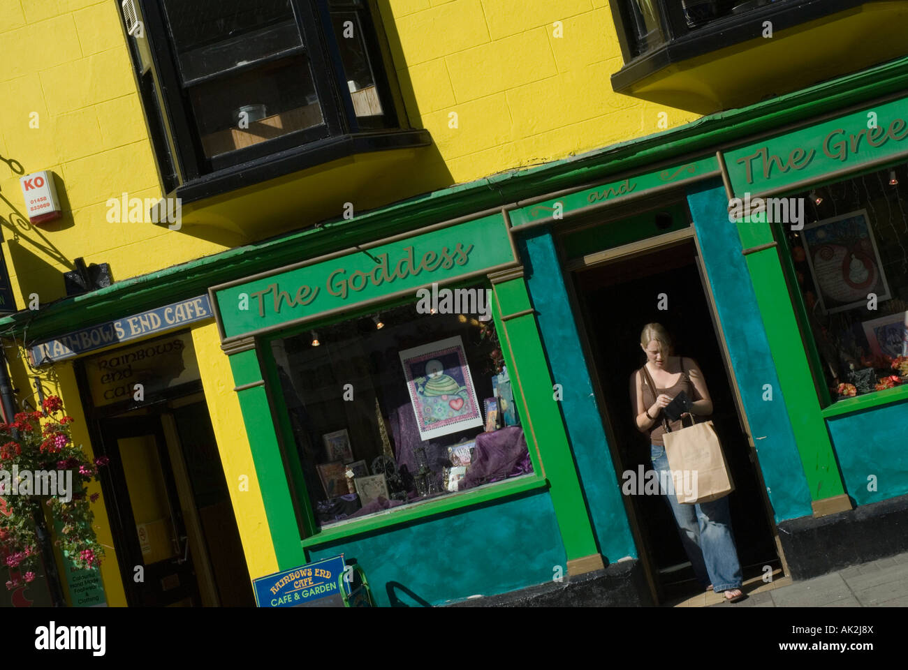 Town centre high street Glastonbury with funky shops Somerset England ...