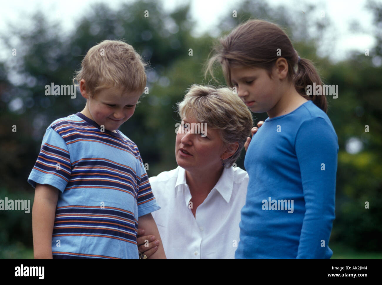 mother having a serious talk to her children Stock Photo - Alamy