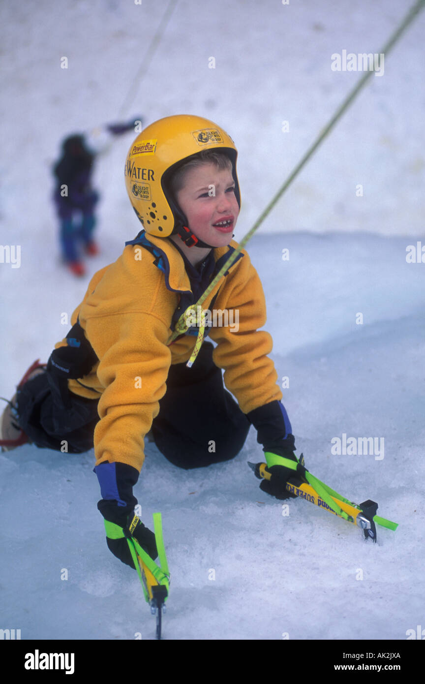 Young boy ice climbing Stock Photo - Alamy