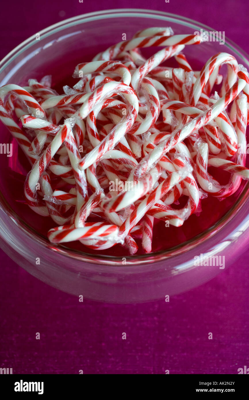 Glass bowl of candy canes Stock Photo - Alamy
