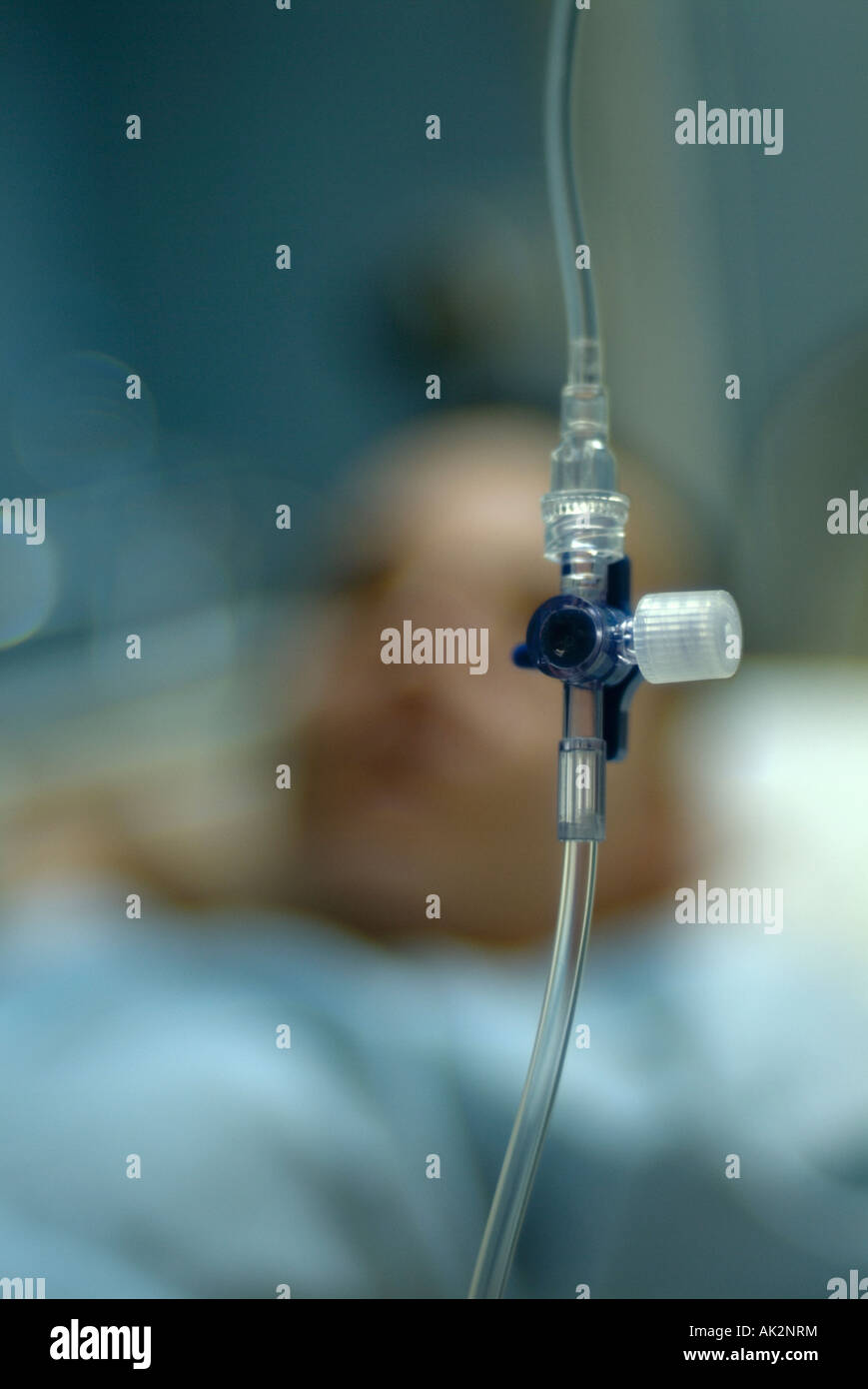 Close up of a IV drip regulator and patient Stock Photo - Alamy