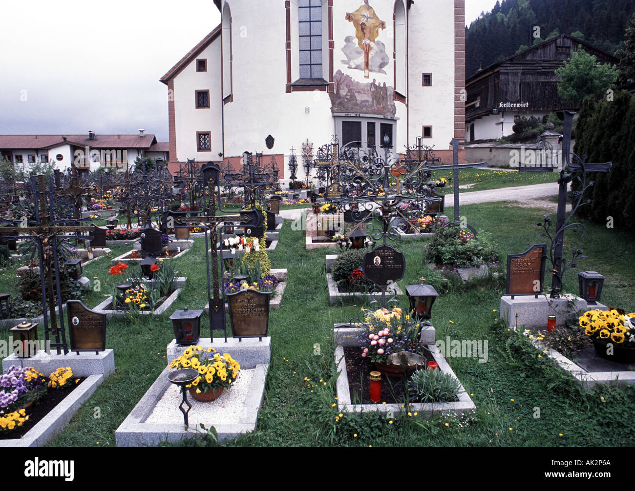 Graveyard with metal crosses at church in Oberau in Wildschonau in ...