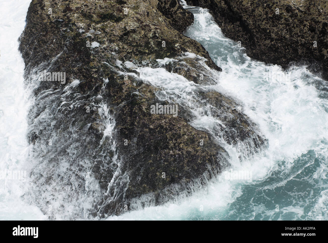 sea waves breaking against rocks Stock Photo - Alamy