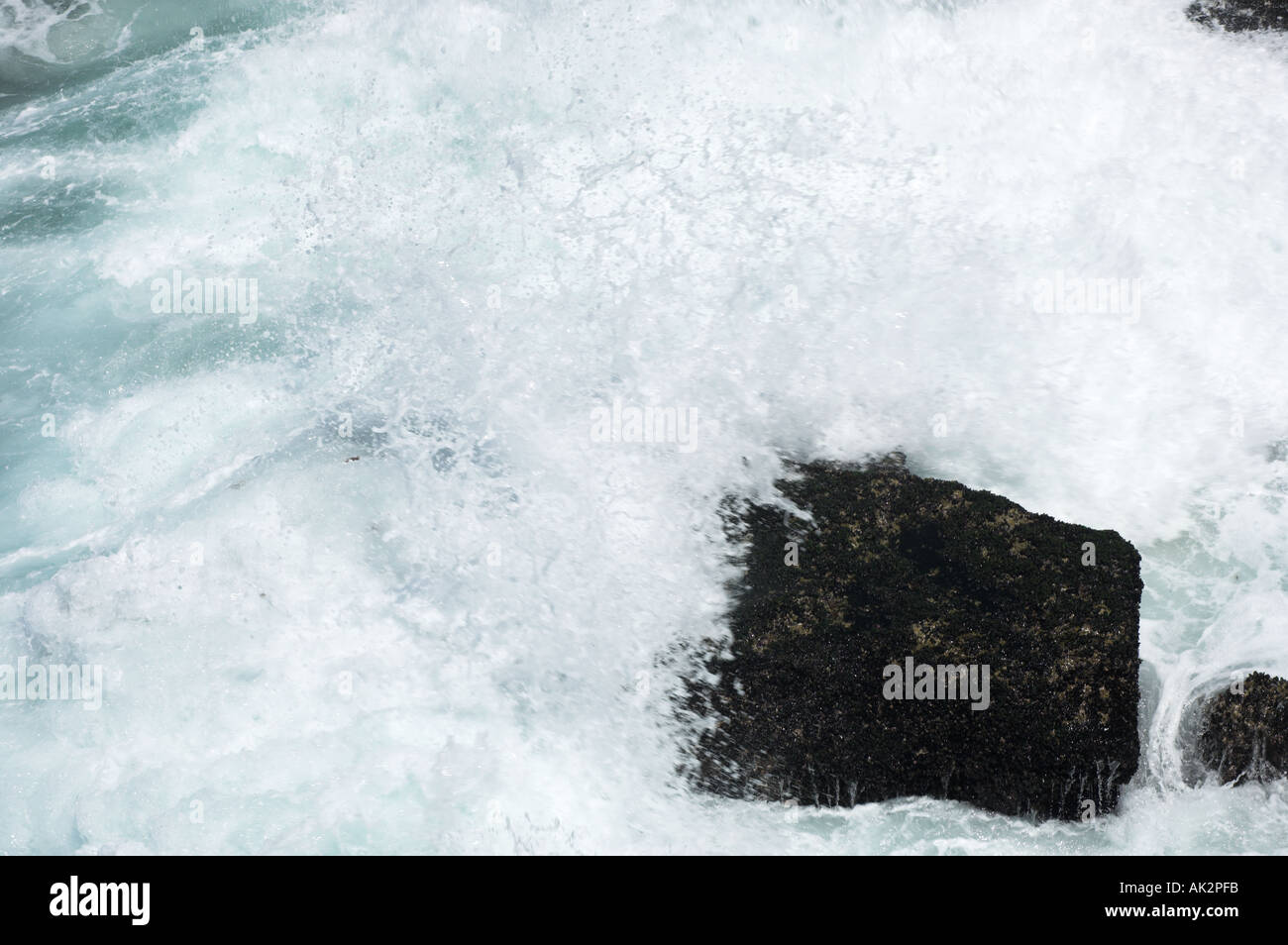 sea waves breaking against rocks Stock Photo - Alamy