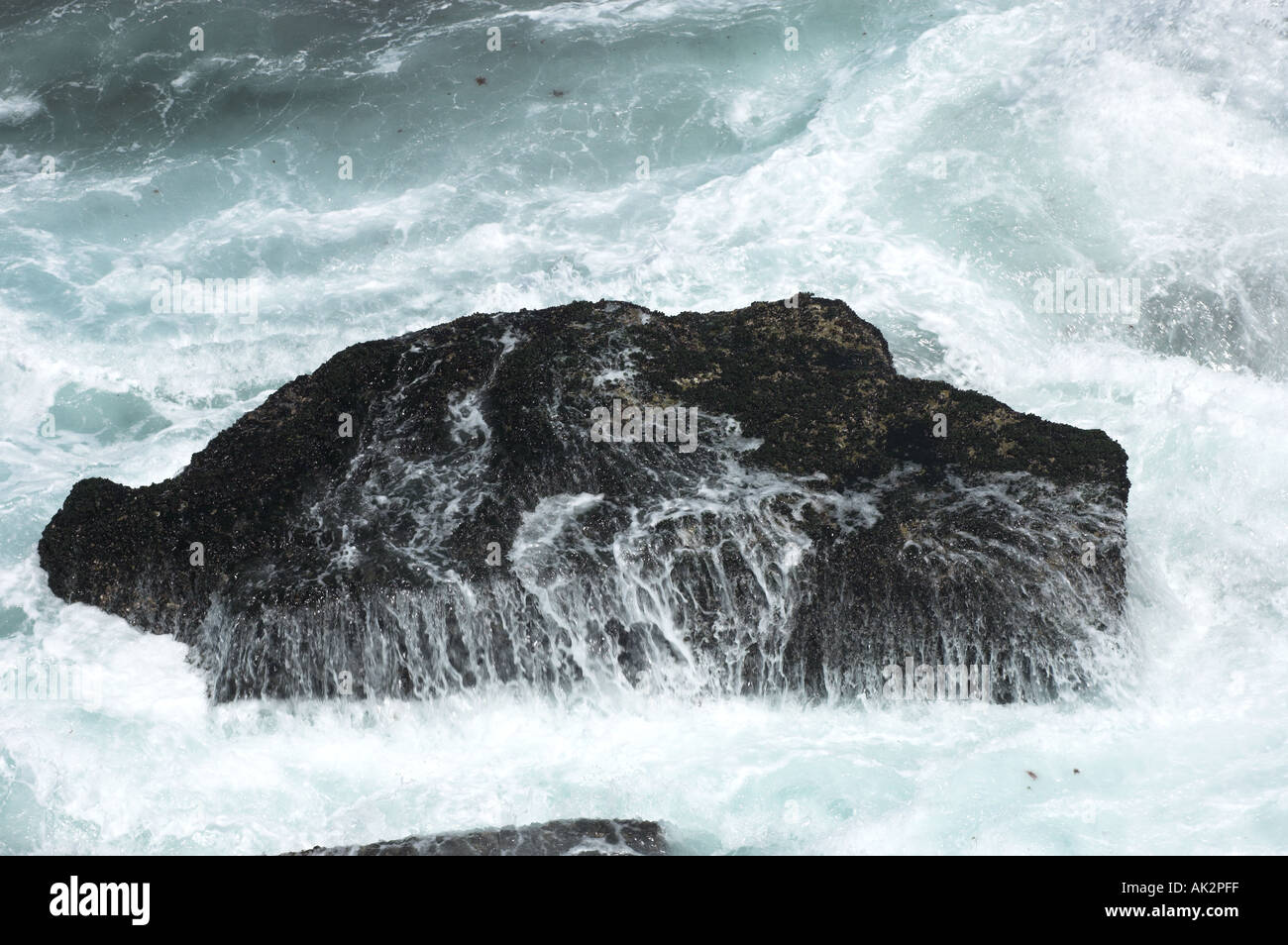 sea waves breaking against rocks Stock Photo - Alamy