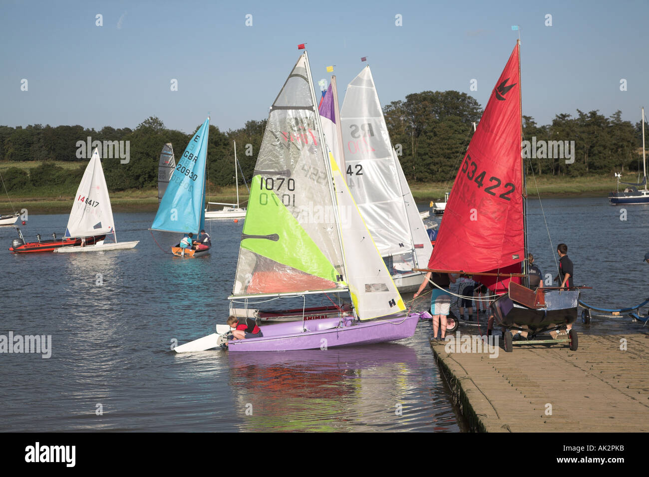 Topper and Mirror sailing dinghy boats being launched River Deben ...