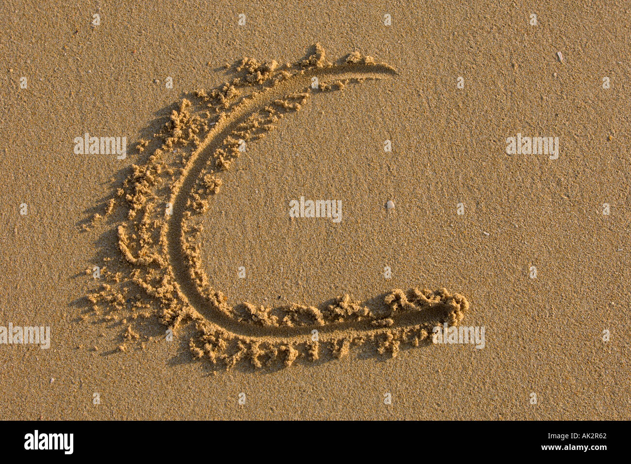 Alphabet hand writing letter on the sand Stock Photo - Alamy